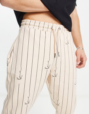 Karl Kani signature pinstripe tracksuit in white | ASOS