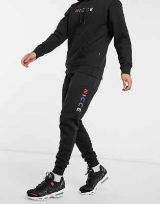 Nicce denver tracksuit with multi colour logo in black | ASOS