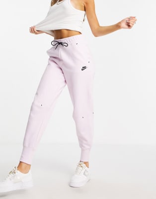 Nike - Tech - Tuta sportiva in pile rosa regale | ASOS