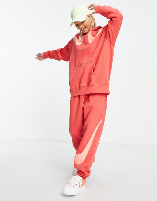 Nike - Tuta sportiva oversize in pile con logo Nike, colore rosa ...