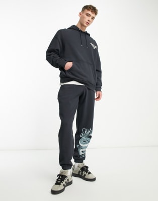 Reclaimed Vintage dragon trackie set in washed charcoal | ASOS