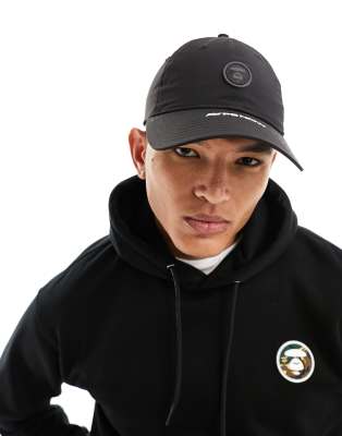 AAPE By A Bathing Ape – Kappe in Schwarz mit „Now“-Schriftzug | ASOS