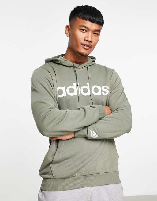 adidas Essentials french terry linear logo hoodie in green | ASOS