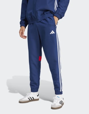 adidas Football Tiro 25 essentials woven pants in team navy / red | ASOS