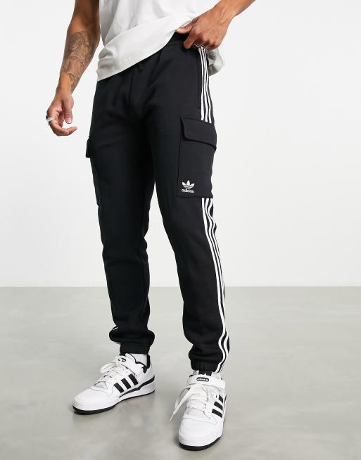 adidas Originals adicolor 3-Stripes cargo trackies in black | ASOS
