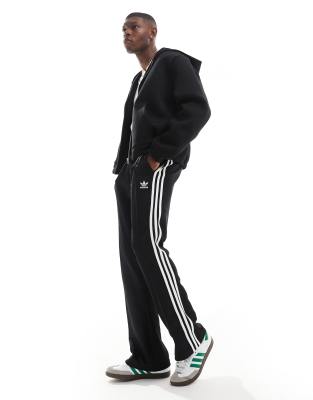 adidas Originals Adicolor flare tracksuit bottoms in black | ASOS