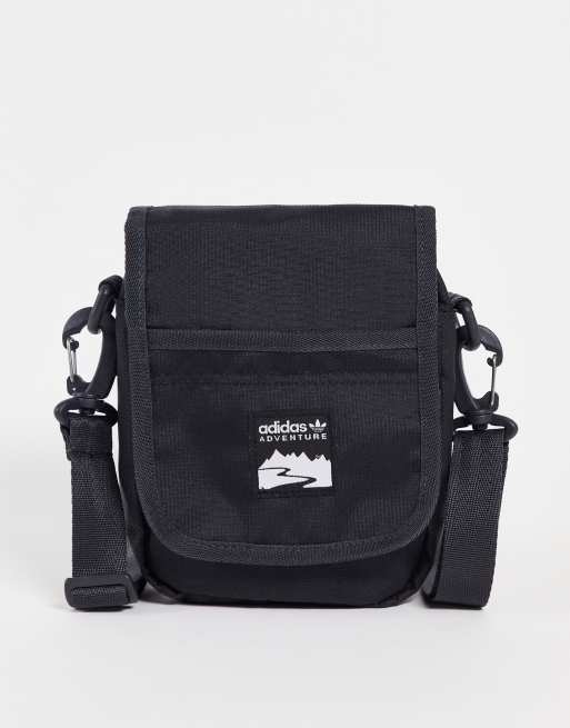 adidas Originals Adventure logo across body bag in black | ASOS
