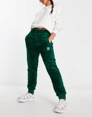 adidas Originals essentials fleece trackies in dark green | ASOS