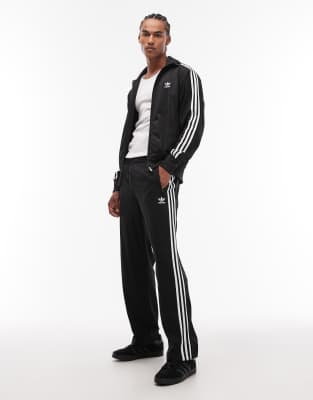 adidas Originals Firebird Loose track pants in black | ASOS