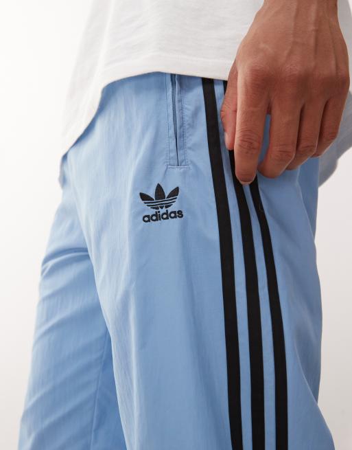 adidas Originals Firebird track pants in blue and black | ASOS