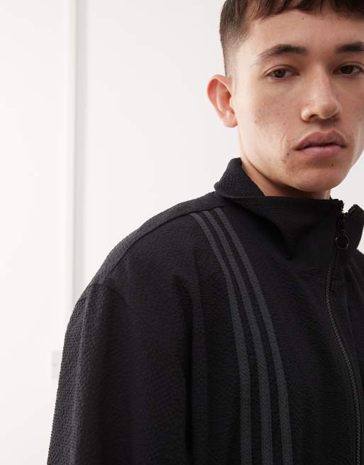 adidas Originals Firebird vertical 3-stripe track top in black | ASOS
