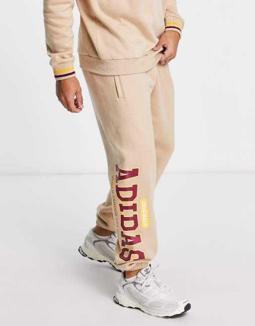 adidas Originals 'Preppy Varsity' large logo oversized trackies in beige | ASOS