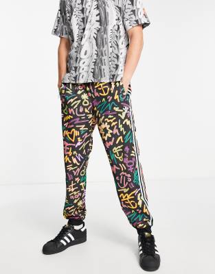 adidas Originals Pride printed track pants in black with Love Unites ...