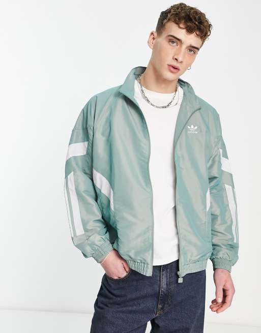 adidas Originals Rekive cut & sew woven track jacket in green | ASOS