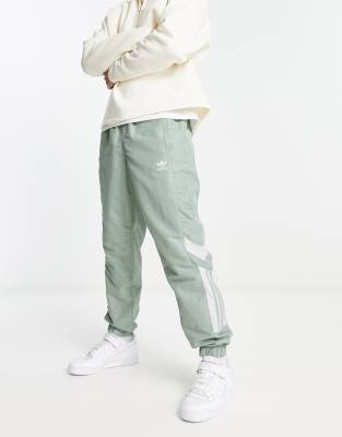 adidas Originals Rekive cut & sew woven track pant in green | ASOS