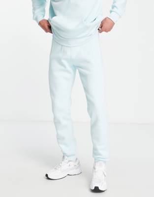 adidas Originals Trefoil Essentials logo joggers in pastel blue | ASOS