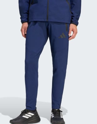 adidas performance Tiro travel woven pants in team navy blue 2 / black ...