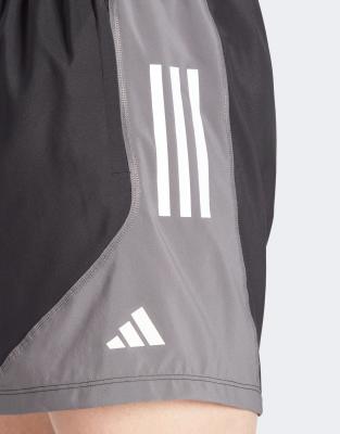 adidas Running Own The Run colorblock shorts in black | ASOS