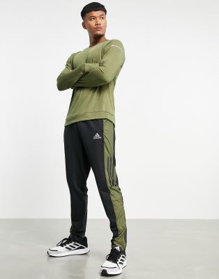 adidas Running trackies with khaki side panel in black | ASOS
