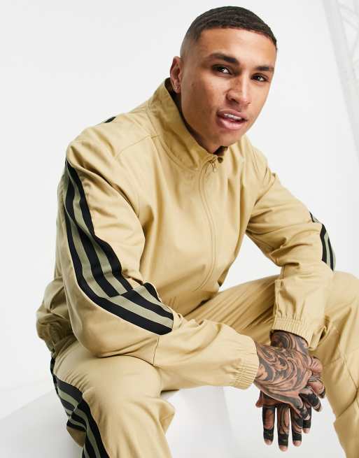 adidas Sportswear Future Icons woven track top in beige | ASOS