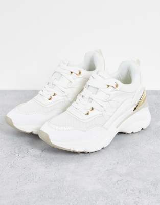 ALDO – Thaliri – Sneaker in Weiß/Gold mit dicker Sohle und Einsätzen | ASOS
