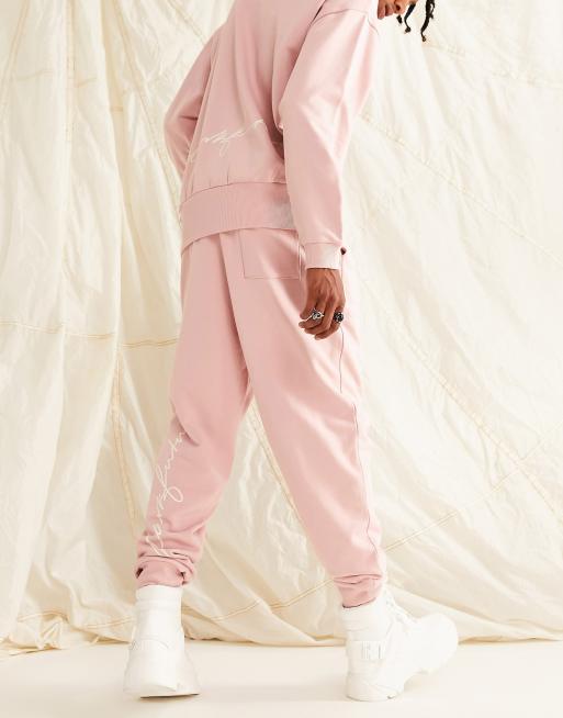 ASOS Dark Future relaxed trackies with front and back logo prints in ...