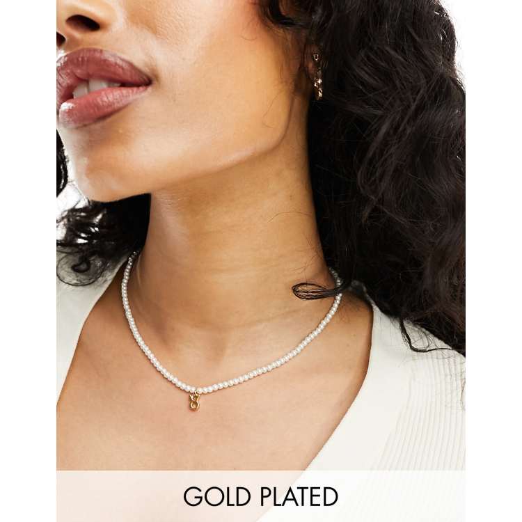 ASOS DESIGN 14k gold plated faux glass pearl necklace with Taurus zodiac with gift bag ASOS