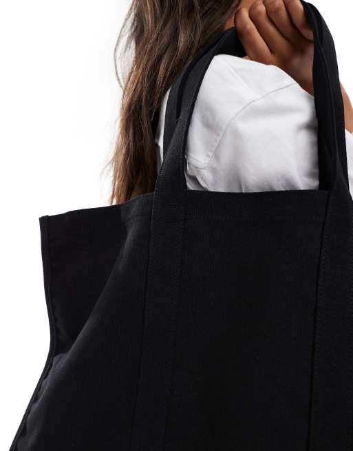 ASOS DESIGN boxy canvas laptop tote bag in black | ASOS