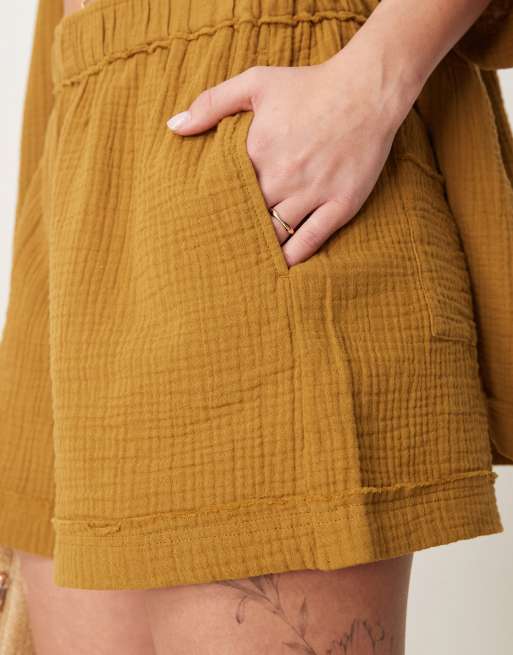 ASOS DESIGN cheesecloth pull on shorts with raw edge detail in olive ...