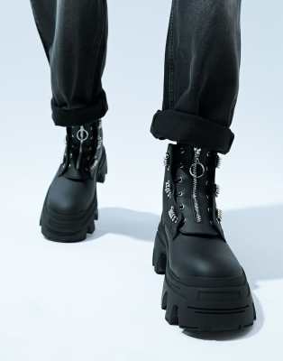 ASOS DESIGN chunky lace-up boots in black with silver monogram detail ...