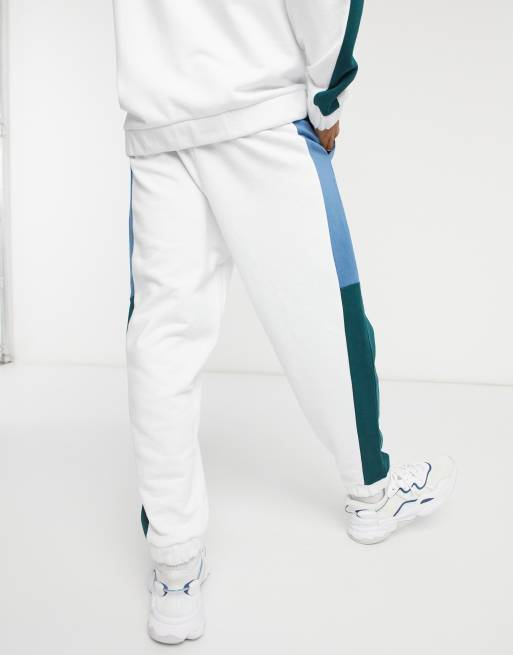 ASOS DESIGN co-ord oversized trackies in white with colour- block side ...