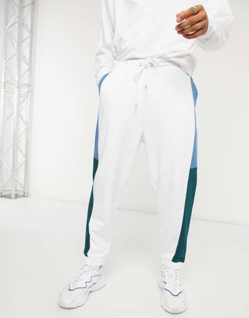 ASOS DESIGN co-ord oversized trackies in white with colour- block side ...