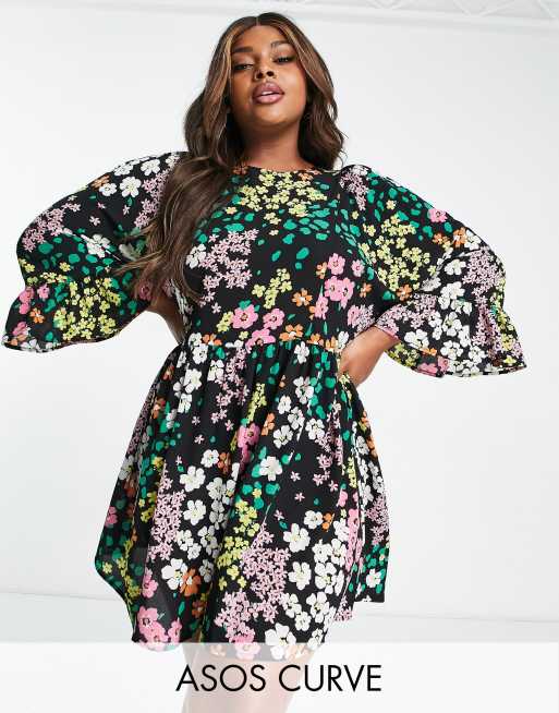 ASOS DESIGN Curve - Robe babydoll courte à manches chauve-souris - Noir à imprimé fleuri | ASOS