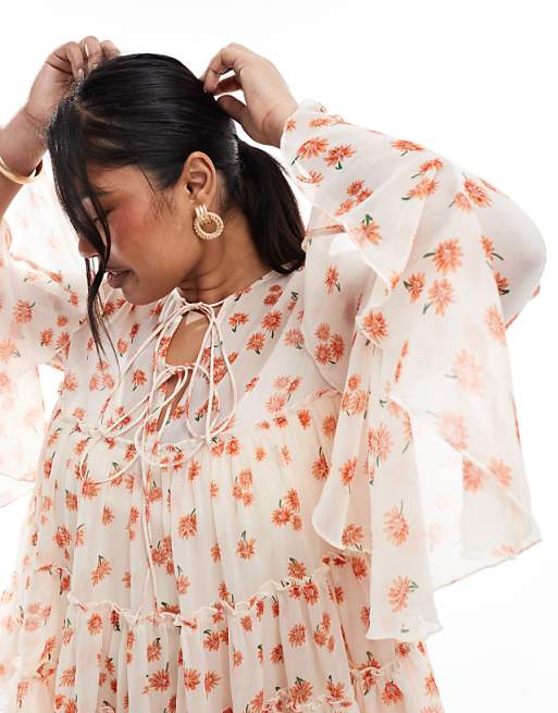 ASOS DESIGN Curve tie front tiered blouse with ruffle cuffs ASOS DESIGN Curve tie front tiered blouse with ruffle cuffs