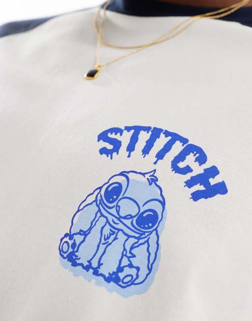 ASOS DESIGN Disney oversized raglan T-shirt with Stitch prints in off ...