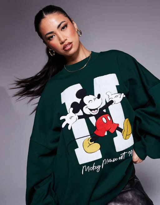 ASOS DESIGN Disney Unisex Sweatshirt in Dunkelgrun mit Mickey Print Super Oversize Schnitt und Stehkragen