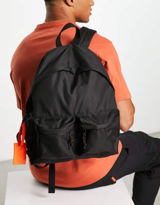 ASOS DESIGN double pocket backpack with orange luggage tag in black | ASOS