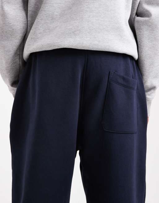 ASOS DESIGN essentials tapered trackies in navy | ASOS