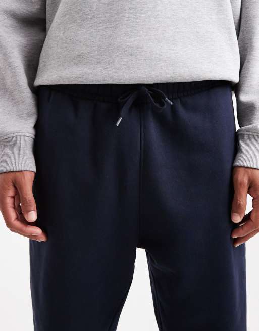 ASOS DESIGN essentials tapered trackies in navy | ASOS