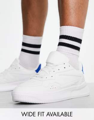 ASOS DESIGN faux leather trainers in white with blue back tab | ASOS