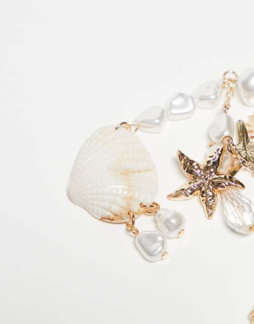 ASOS DESIGN fish & faux shell bag charm in gold | ASOS