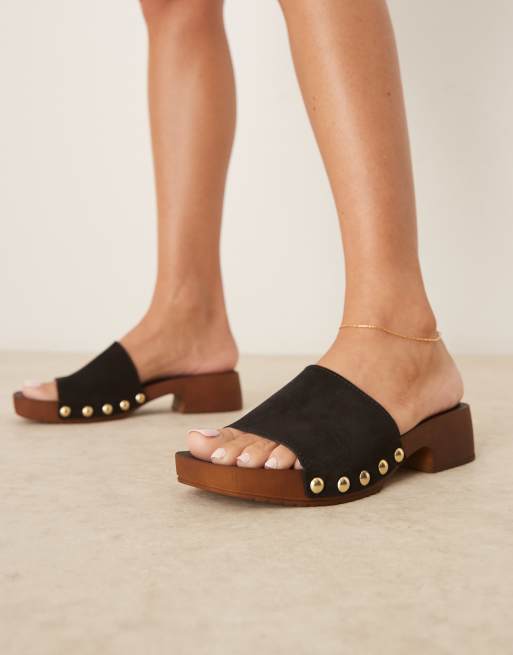 ASOS DESIGN Flare suede mule sandal clogs in black | ASOS