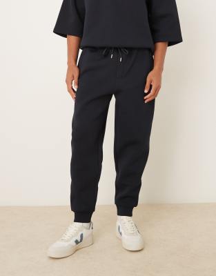 ASOS DESIGN heavyweight tapered fit trackies in scuba-style fabric in ...