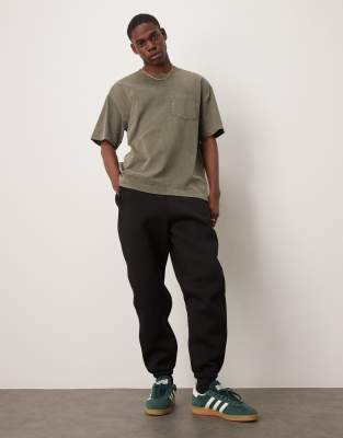 ASOS DESIGN heavyweight tapered trackies in scuba-style fabric in black ...