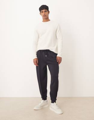 ASOS DESIGN heavyweight tapered trackies in scuba-style fabric in navy ...
