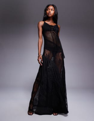 ASOS DESIGN - Hoogsluitende maxi jurk van doorschijnend kant met mix van franjes in zwart | ASOS