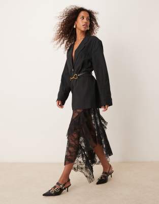 ASOS DESIGN - Jupe mi-longue fluide en dentelle avec ourlet asymétrique et volants - Noir | ASOS