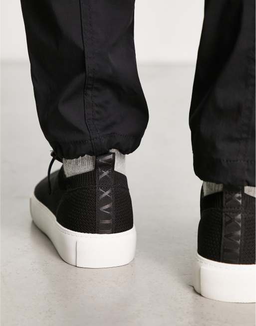 ASOS DESIGN knitted slip on sneakers in black | ASOS