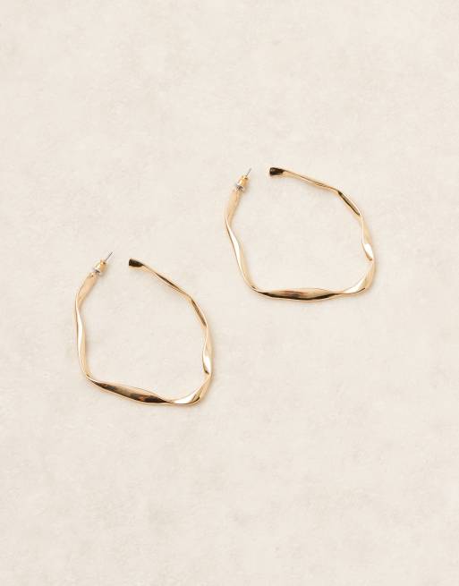 ASOS DESIGN large hoop earrings in abstract twist shape in gold tone | ASOS