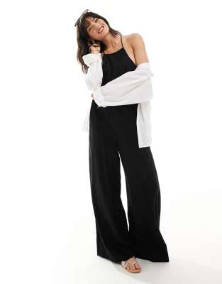 ASOS DESIGN - Linnen jumpsuit met racerhals en kruisarcering in zwart ...